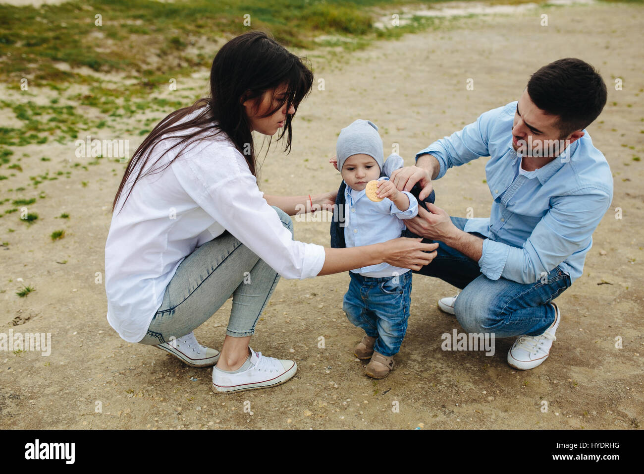 Happy young family with a little boy in nature Stock Photo - Alamy