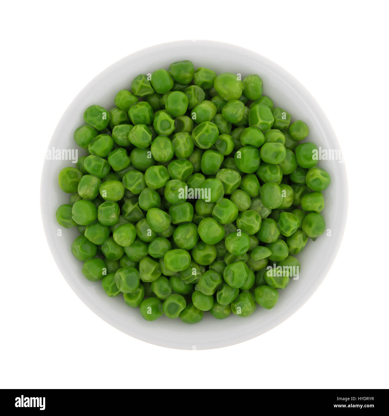 Top view of a white bowl filled with cooked green peas isolated on a ...