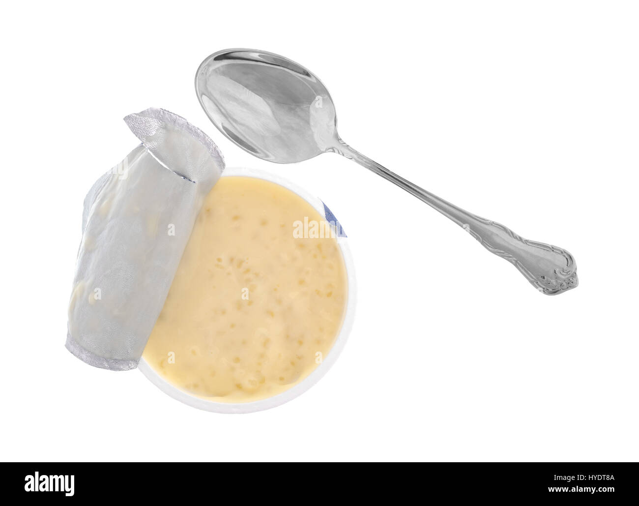 Top view of tapioca pudding in an opened small plastic container with a ...