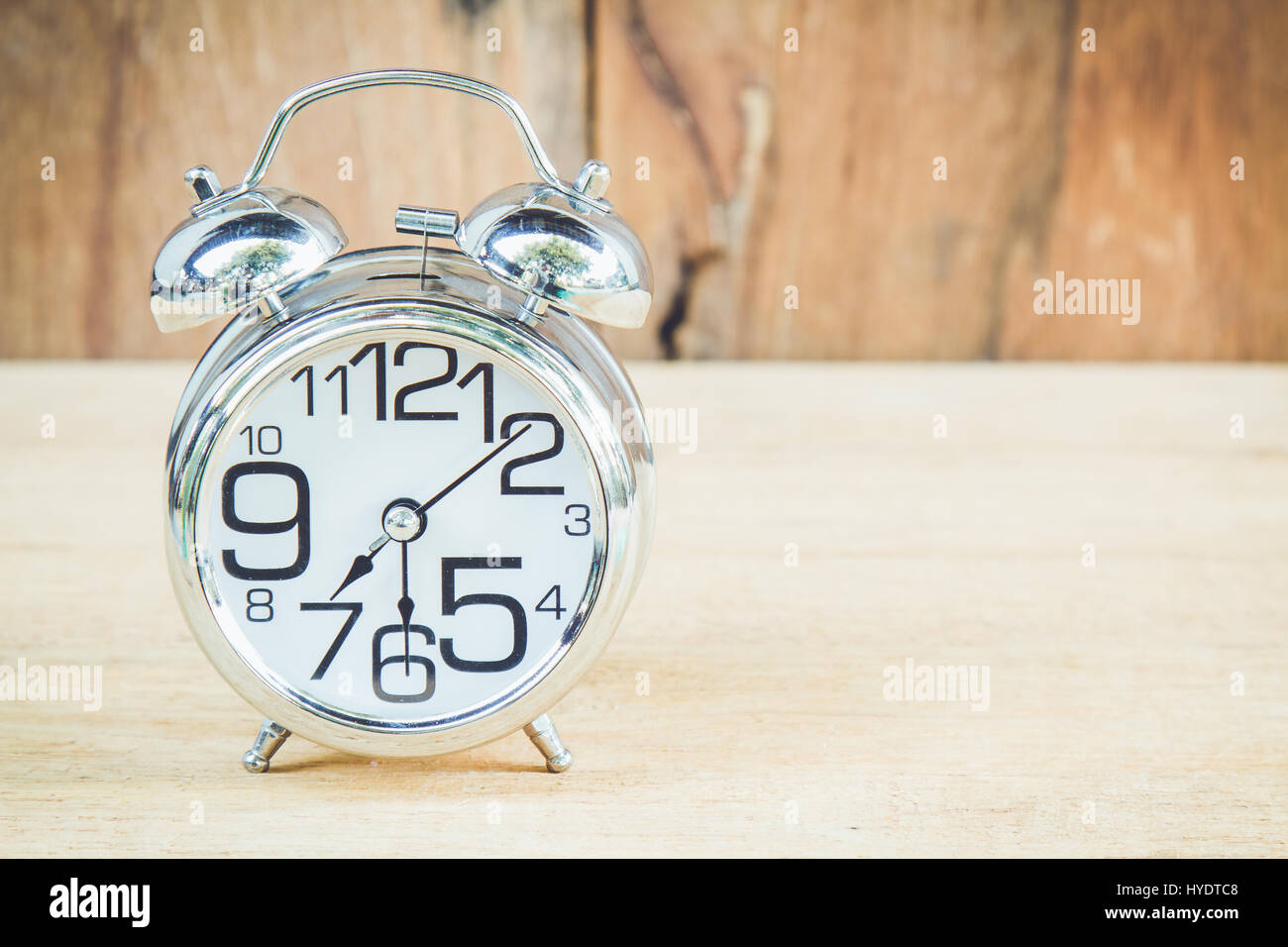 Clock show 7 am or pm and 30 minute on wood background with copy space ...