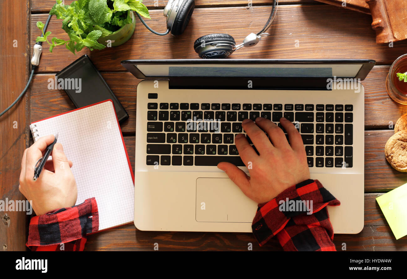 Wooden desktop with laptop, books and headphones Stock Photo - Alamy