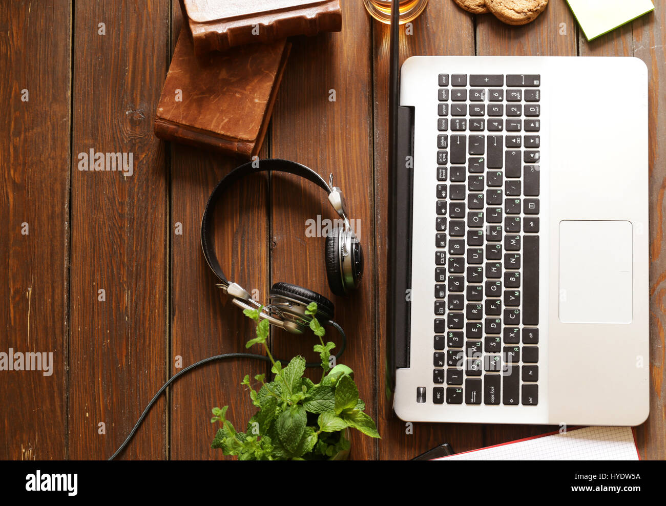 Wooden desktop with laptop, books and headphones Stock Photo - Alamy
