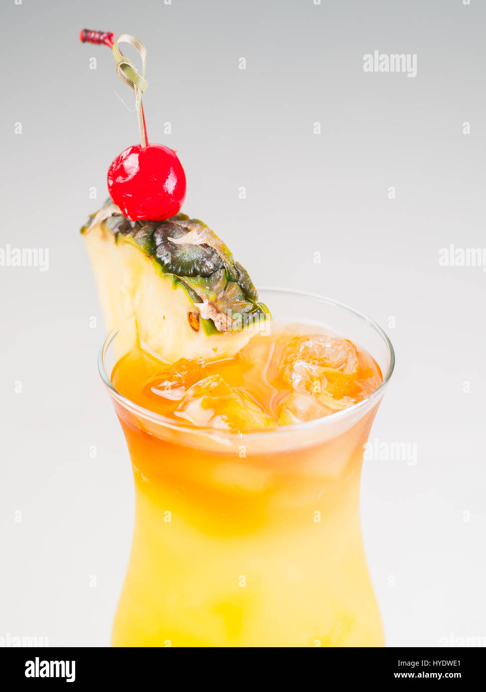 Colorful bright cocktail decorated with ice, sugar and fruit. Cooling ...