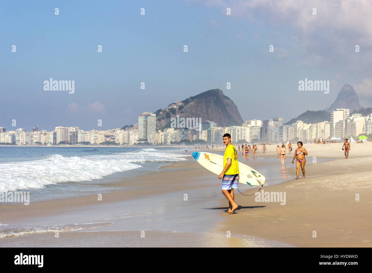 Brazil, Rio de Janeiro : Young surfer carrying his surf board Stock ...