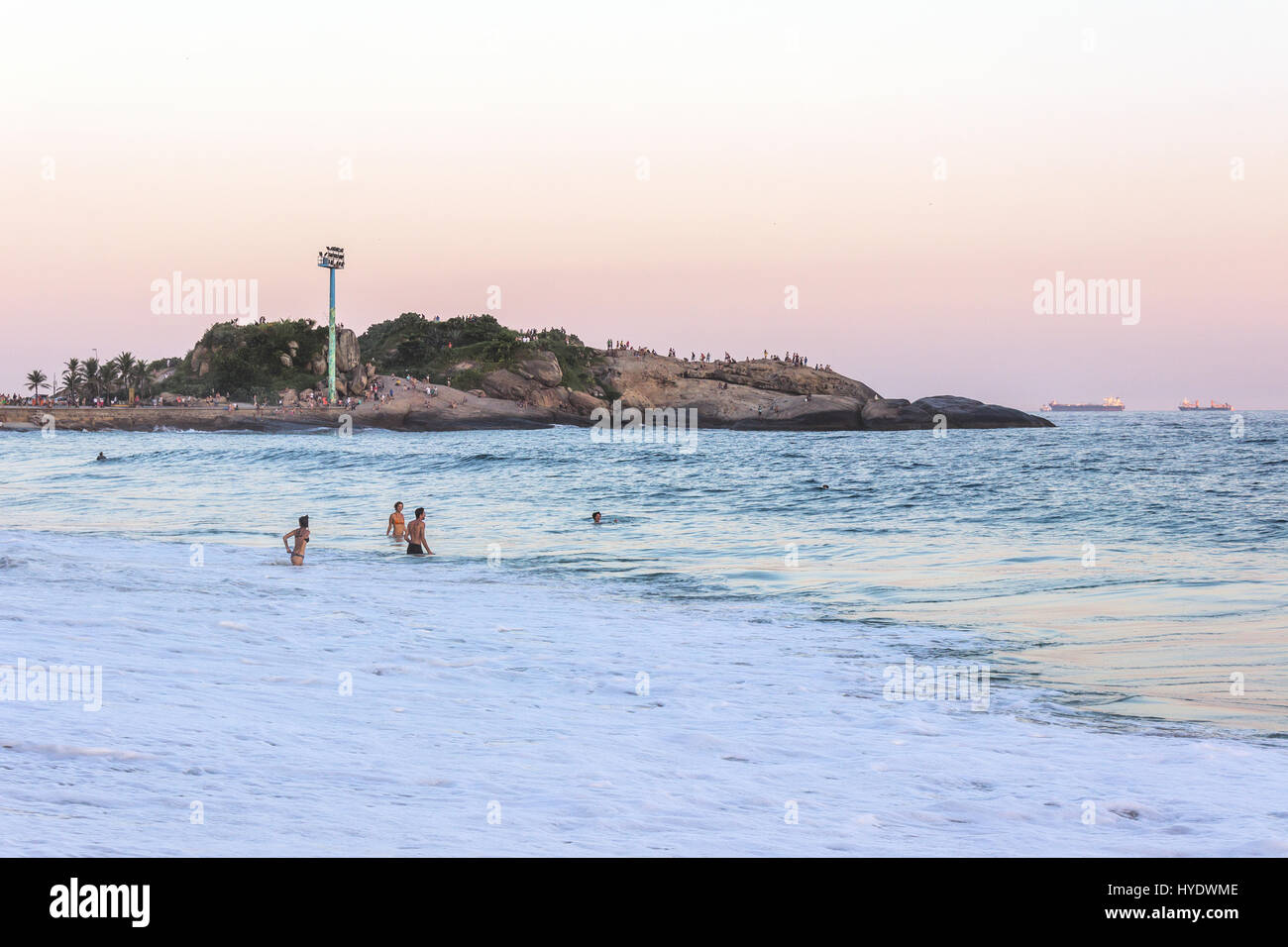 Brazil, Rio de Janeiro: View of Arpoador rock on Ipanema beach during ...