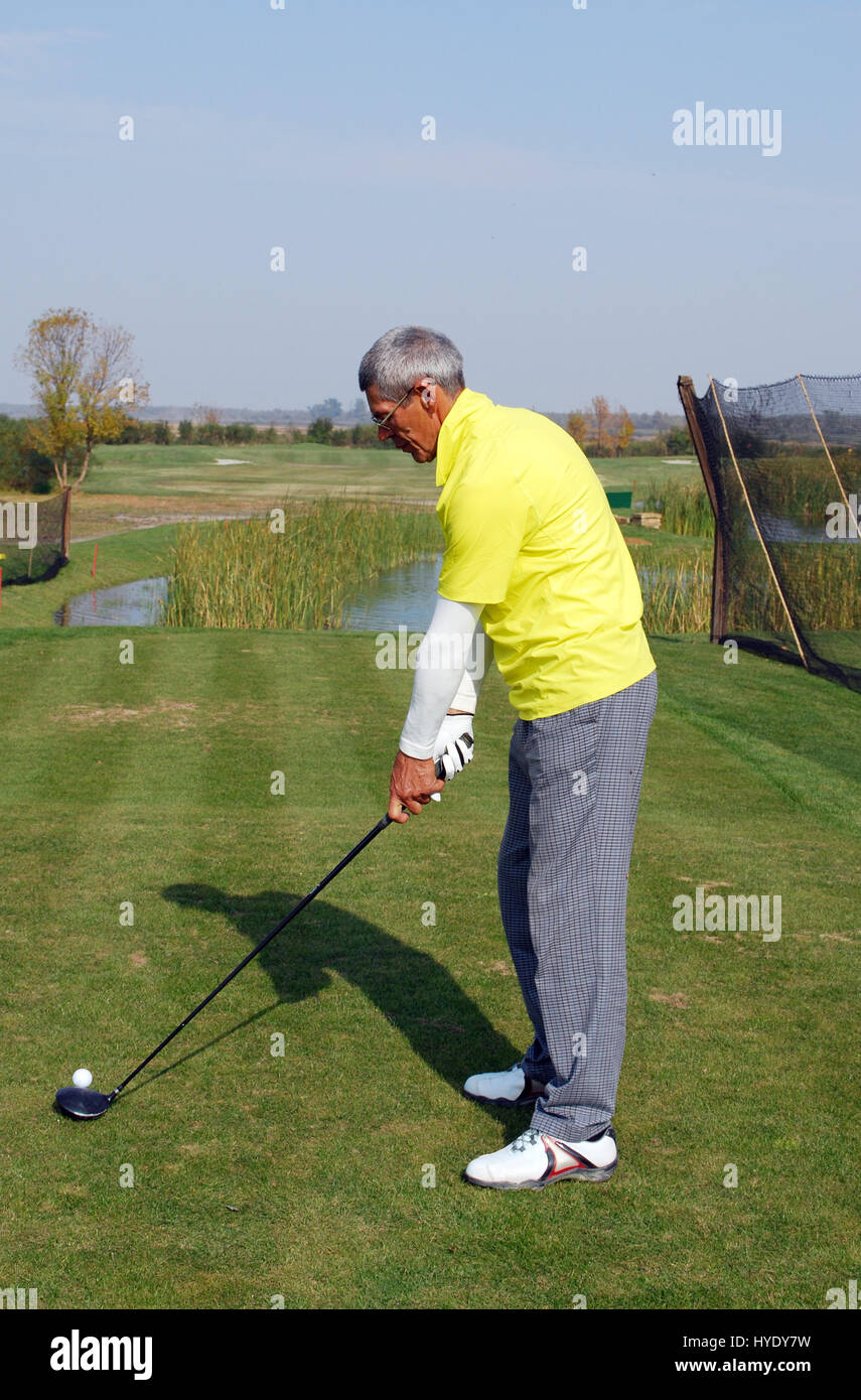senior golf player ready for hit Stock Photo - Alamy