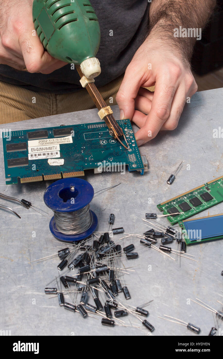 Solder soldering solder integrated circuit. An employee at an electric ...