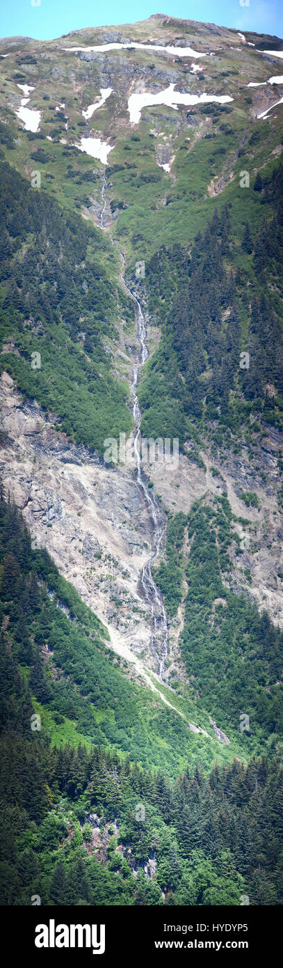 The vertical panoramic view of Juneau mountain waterfall in Juneau city ...