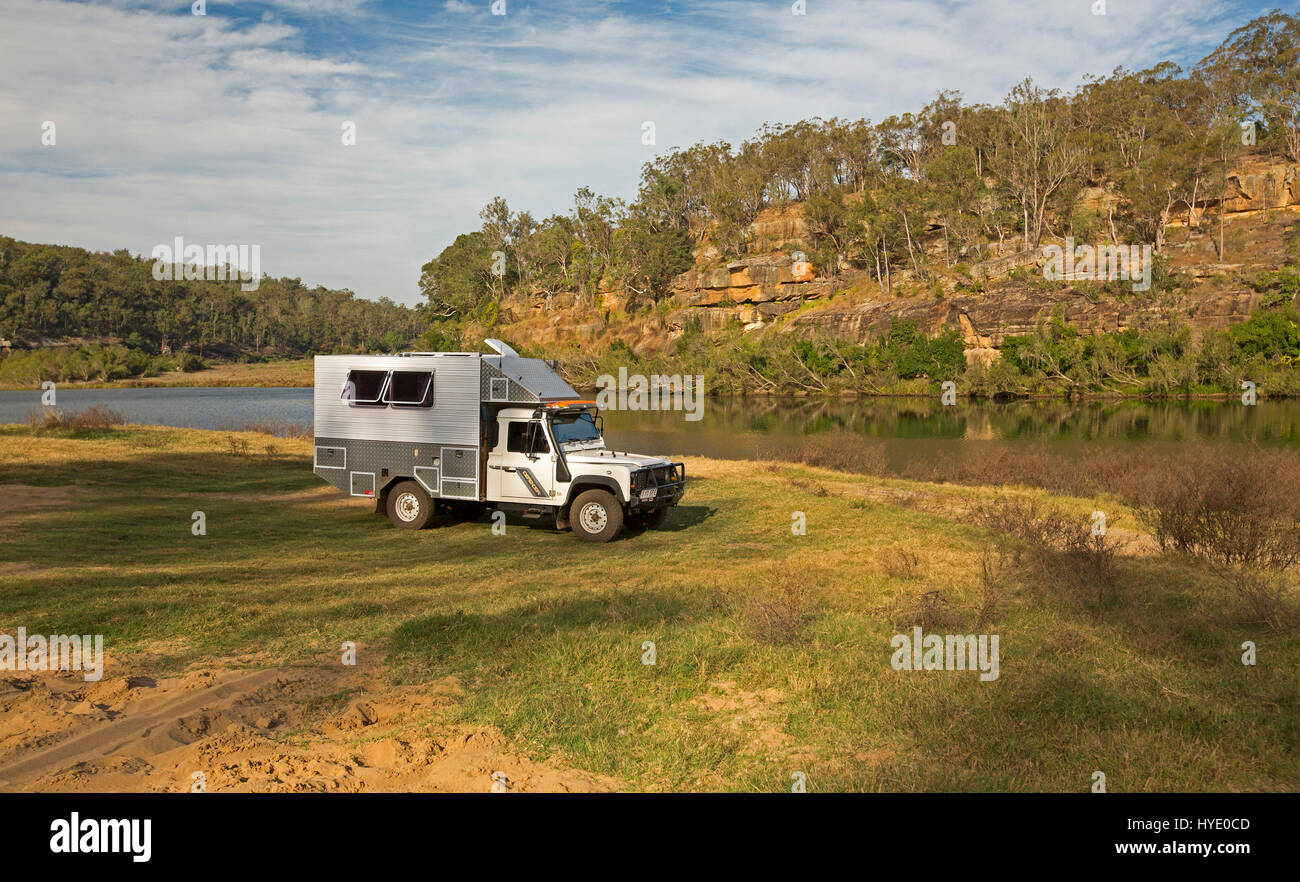 Home-made Land Rover campervan / mobile home at camping area beside ...