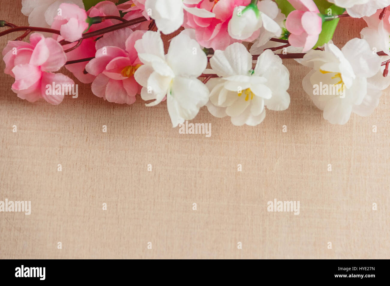 Frame of spring flowers on a wooden ,with space for text ,spring or ...