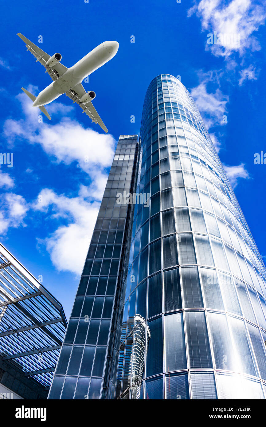 airplane with modern building. Jet over City Stock Photo - Alamy