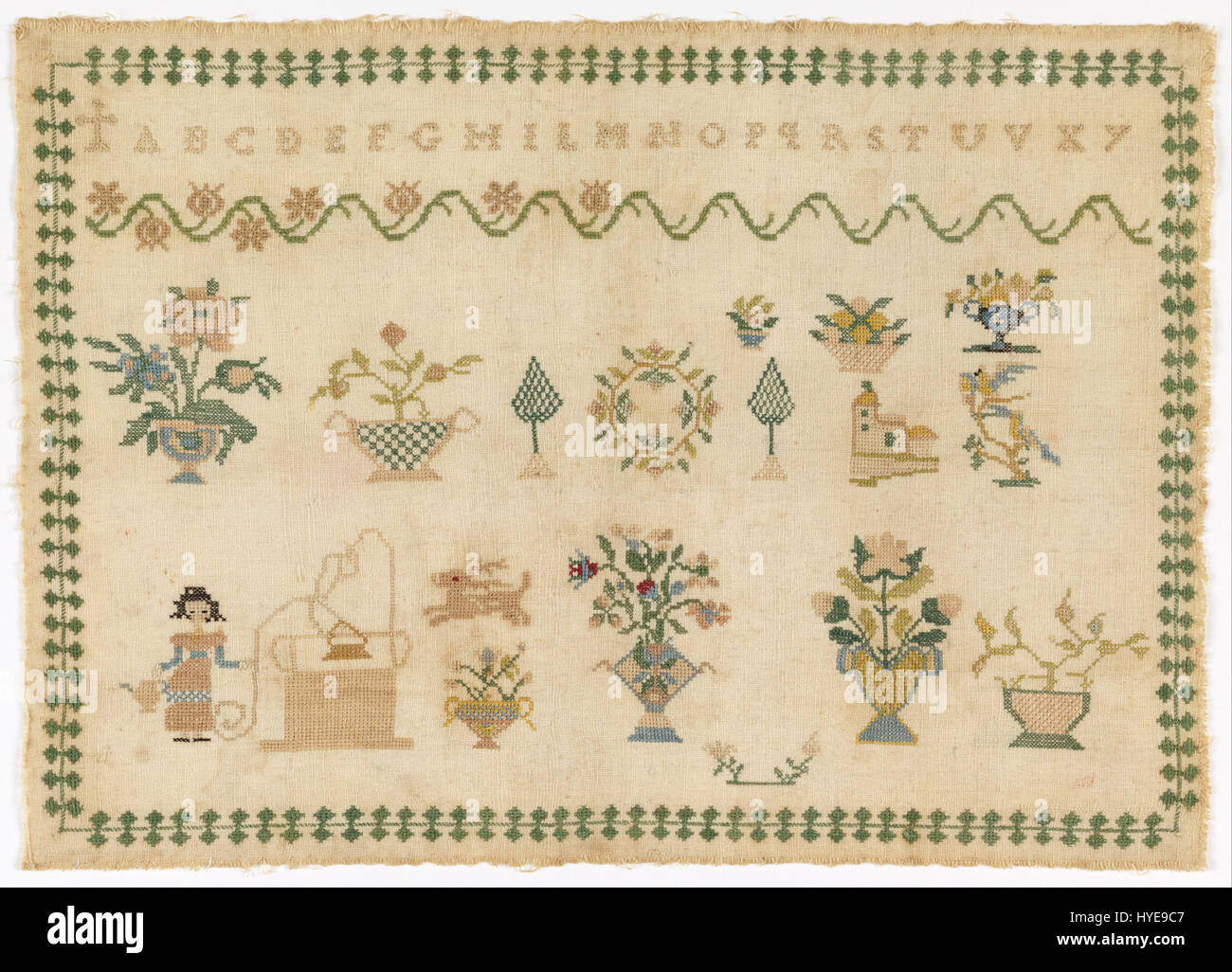 This sampler is a textile piece showcasing intricate needlework ...