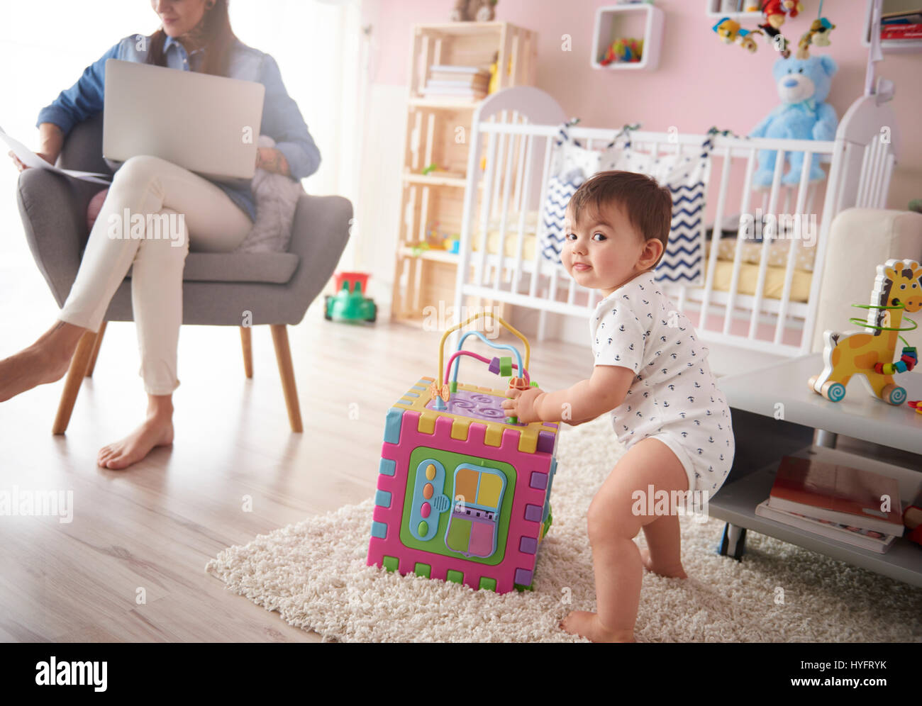 Close up of adorable boy with busy mummy Stock Photo - Alamy