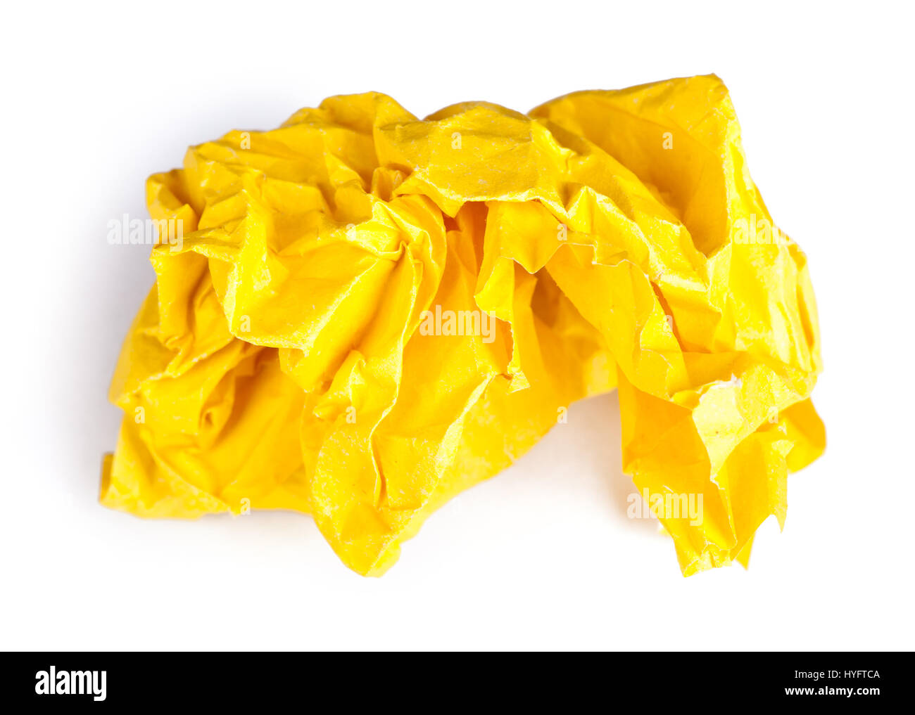 Screwed up piece of yellow paper isolated on white background Stock ...