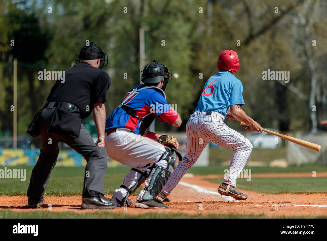 Baseball Batter, Plate Umpire and catcher looking at flying ball Stock ...