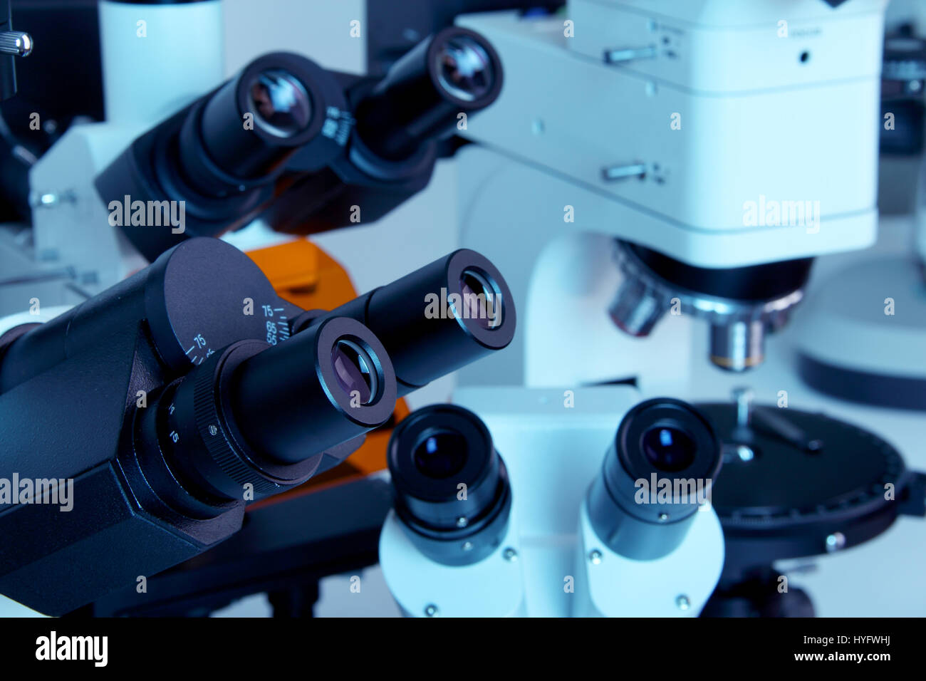 Group of various Microscopes in blue medicine light Stock Photo - Alamy