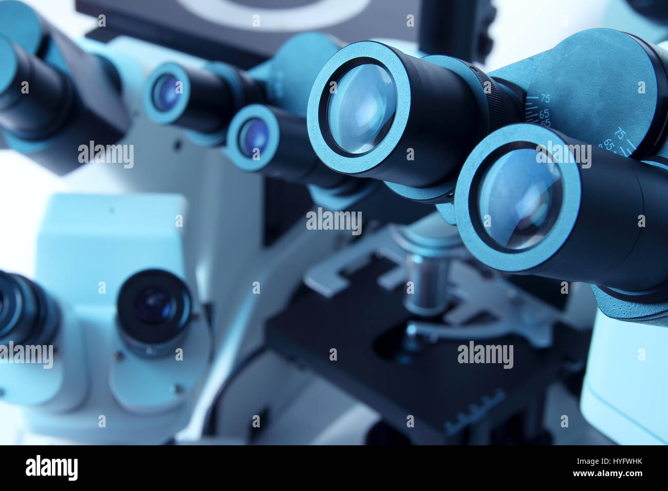 Group of various Microscopes in blue medicine light Stock Photo - Alamy