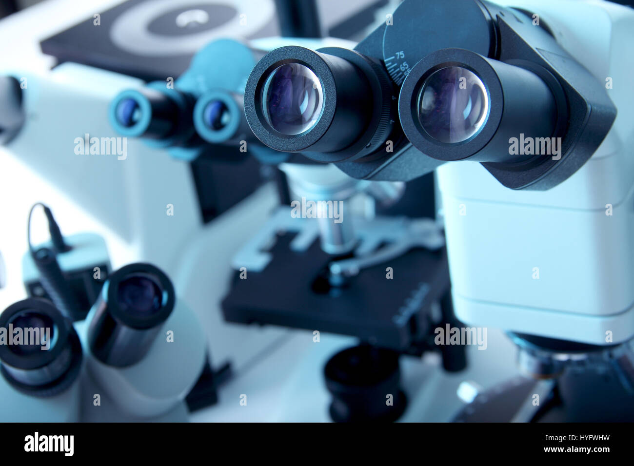 Group of various Microscopes in blue medicine light Stock Photo - Alamy