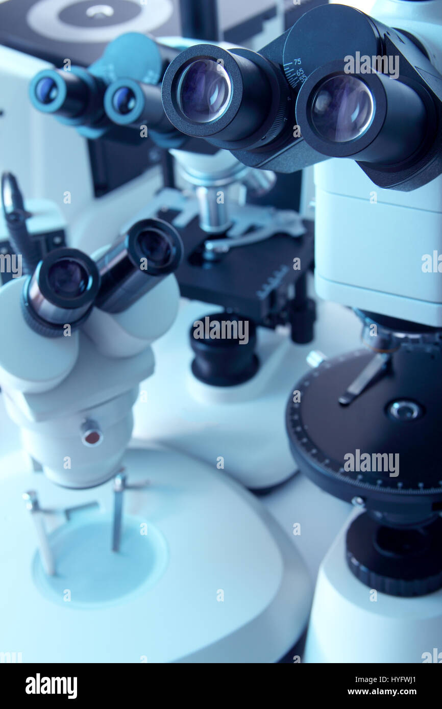 Group of various Microscopes in blue medicine light Stock Photo - Alamy