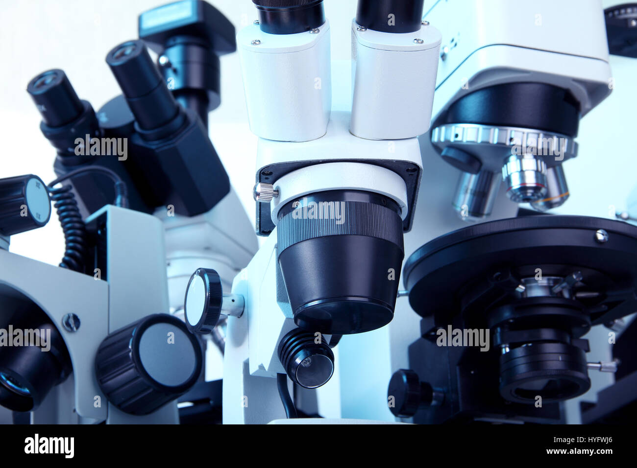 Group of various Microscopes in blue medicine light Stock Photo - Alamy