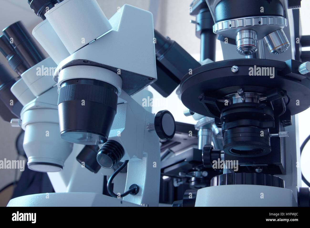 Group of various Microscopes in blue medicine light Stock Photo - Alamy