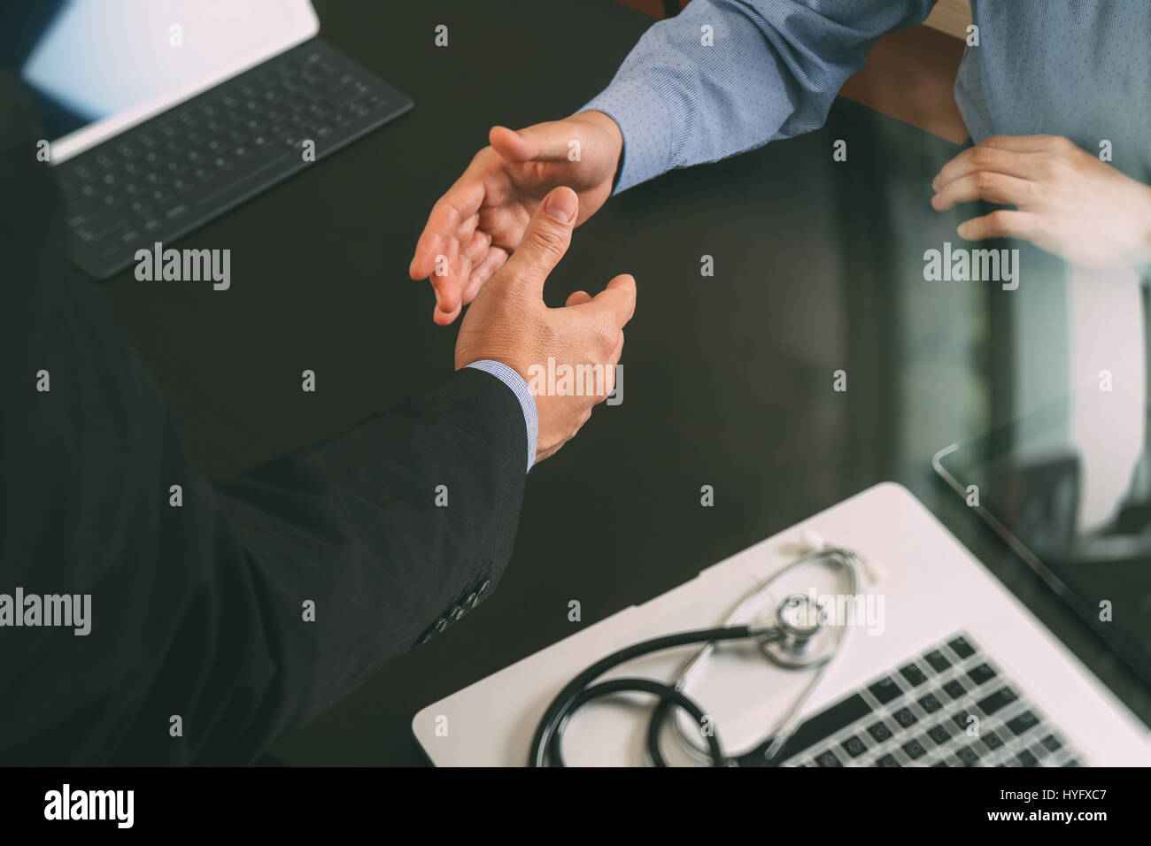 Medical and healthcare concept,Doctor and patient shaking hands in ...