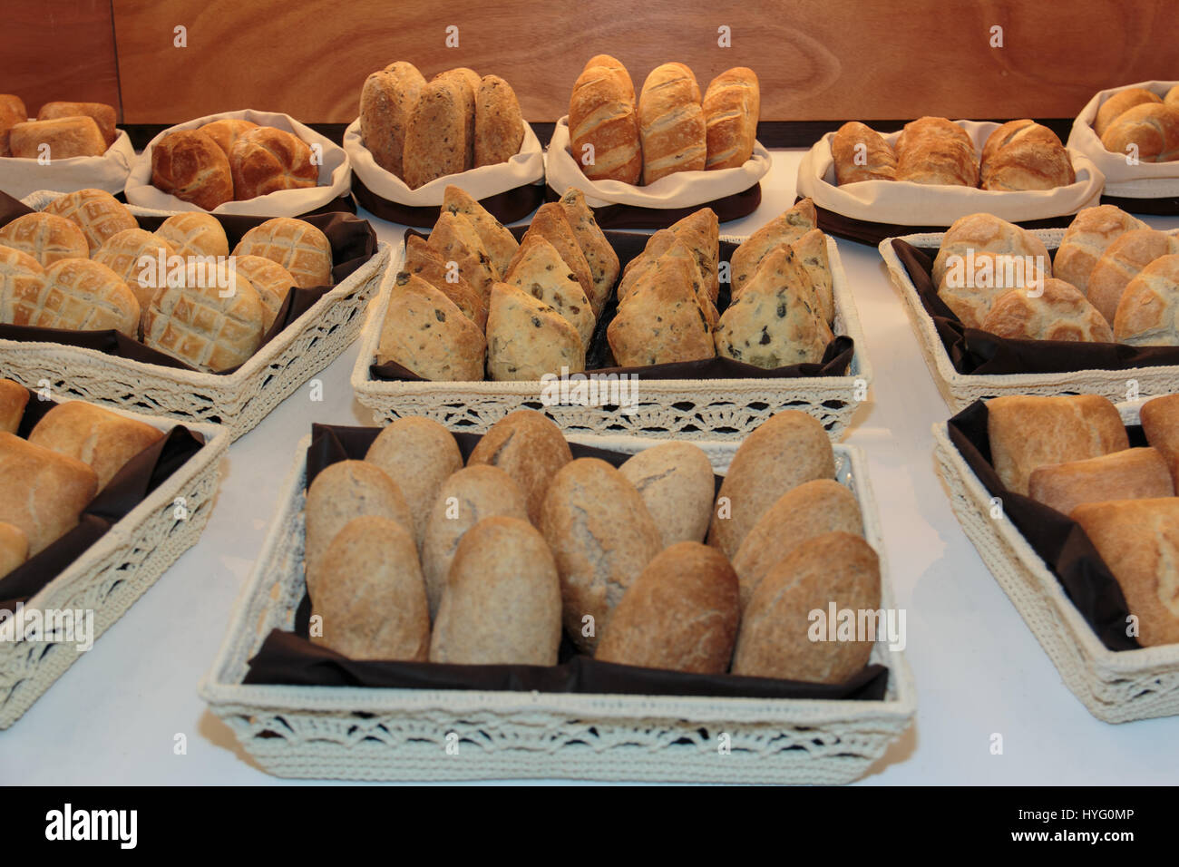 Bread Assortment inside White Baskets shown in Bakery Stock Photo - Alamy