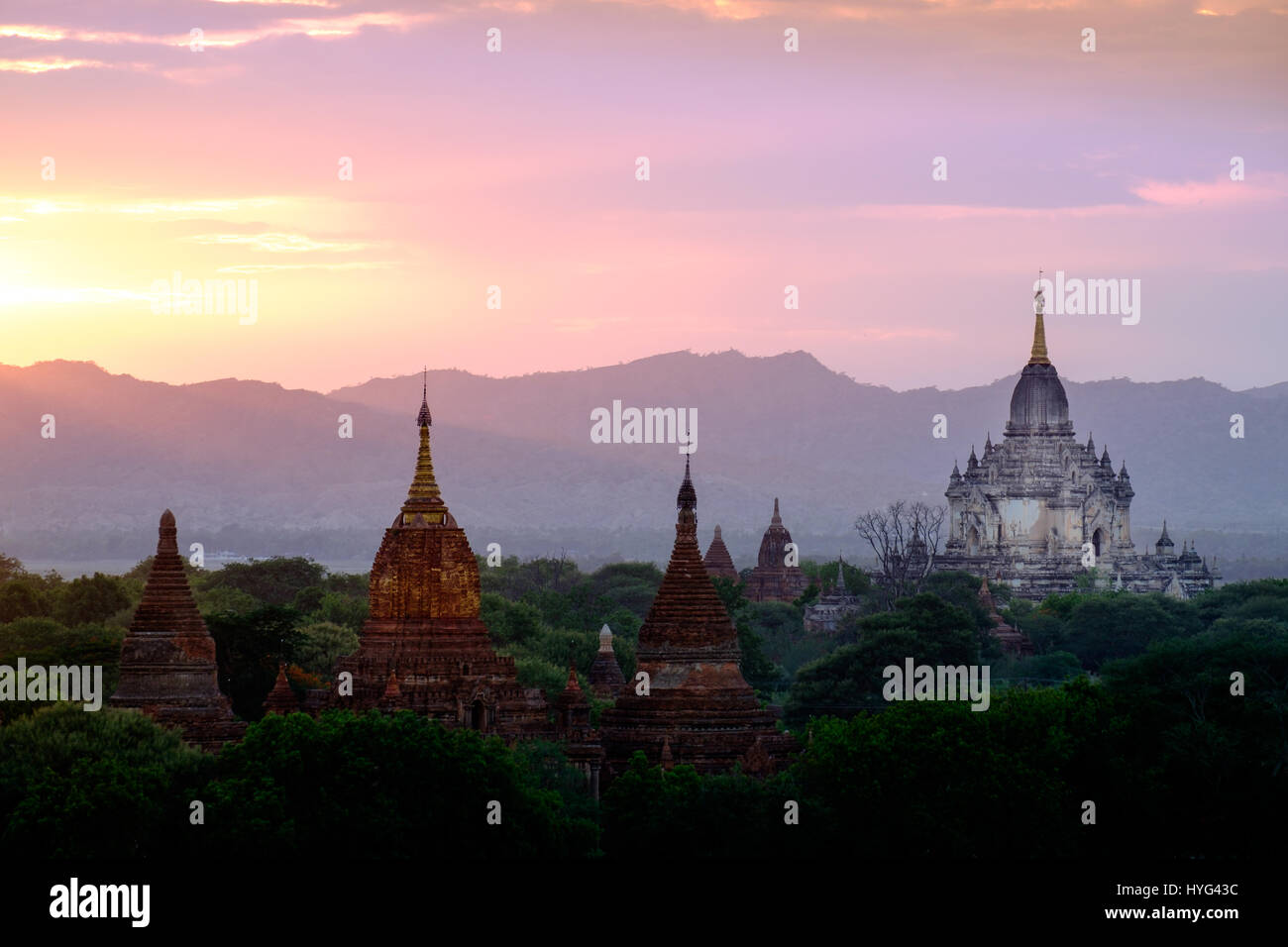 Colorful sunset landscape view with silhouettes of temples, Bagan ...