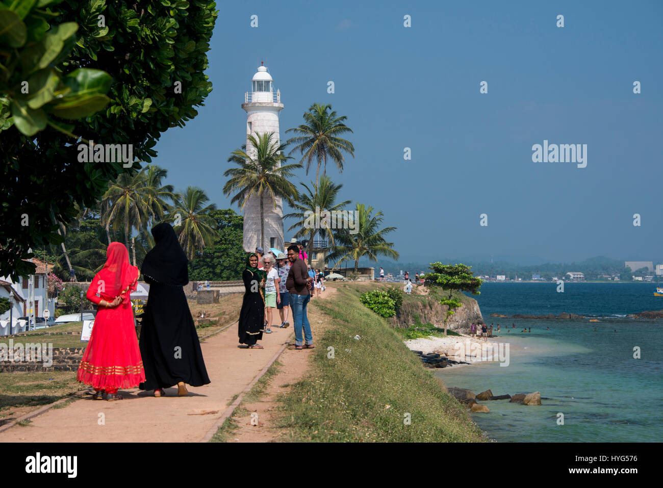 Sri Lanka, Port city of Galle. Tourists walking along the fort walls ...