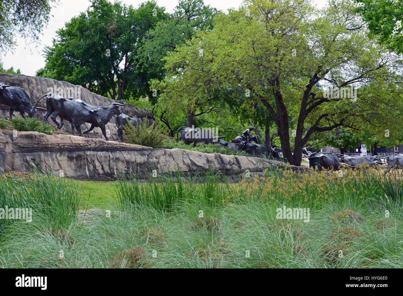 Multiple bronze statues form part of an old west cattle drive sculpture ...