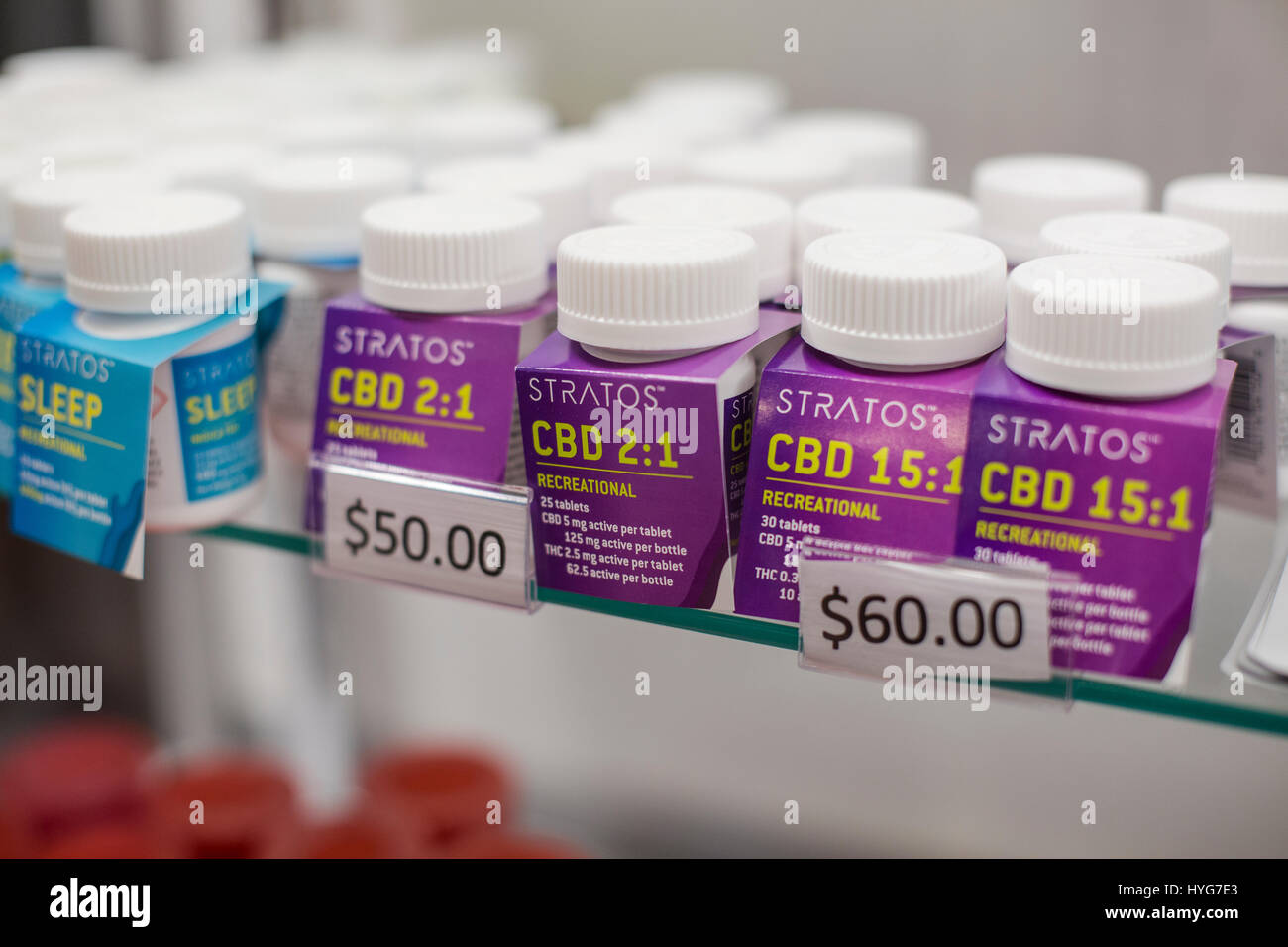 various bottles of Stratos brand recreational TCH tablets on the shelf ...