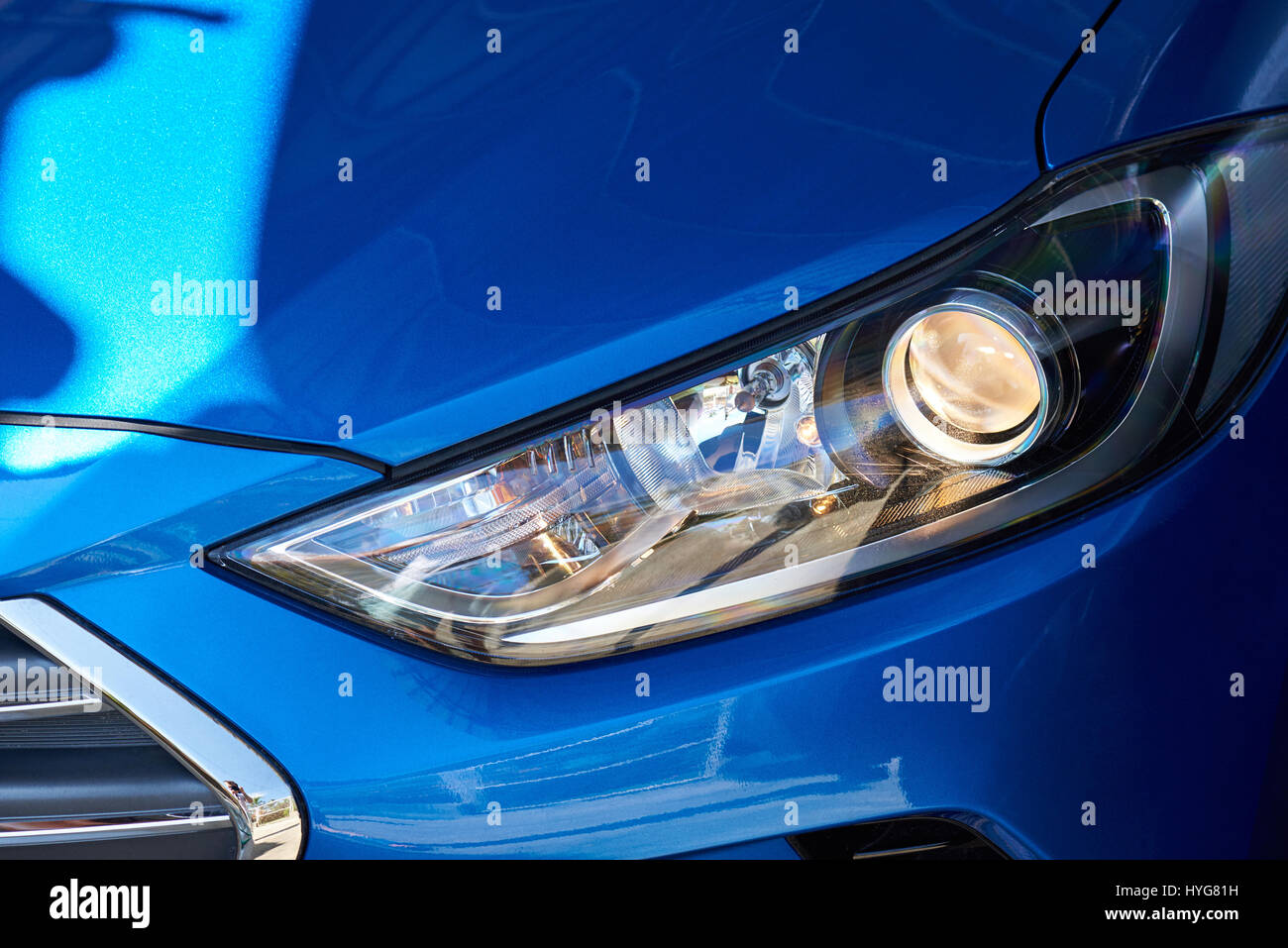 New headlight of blue car. Closeup of modern sport car head light Stock ...