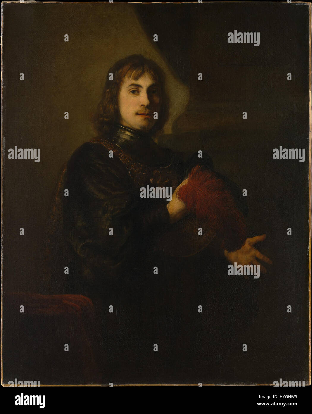 This Rembrandt portrait presents a man dressed in a gorget, holding a ...