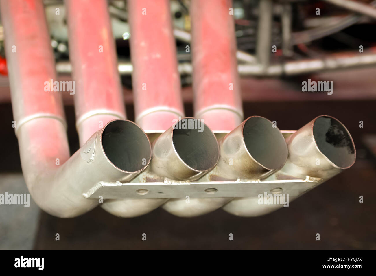 closeup of exhaust pipes on a high performance race car Stock Photo - Alamy