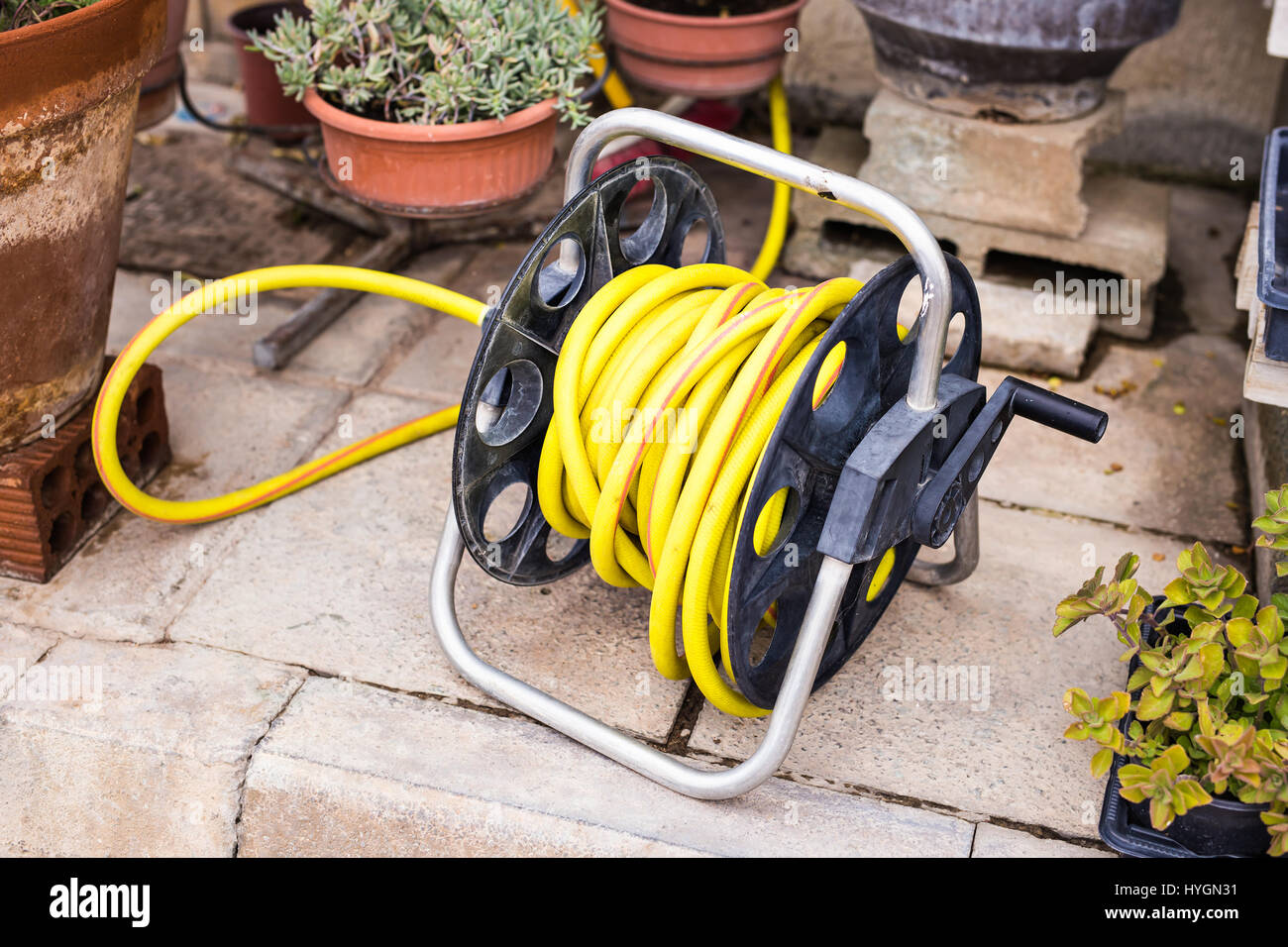 Yellow Garden hose Stock Photo - Alamy