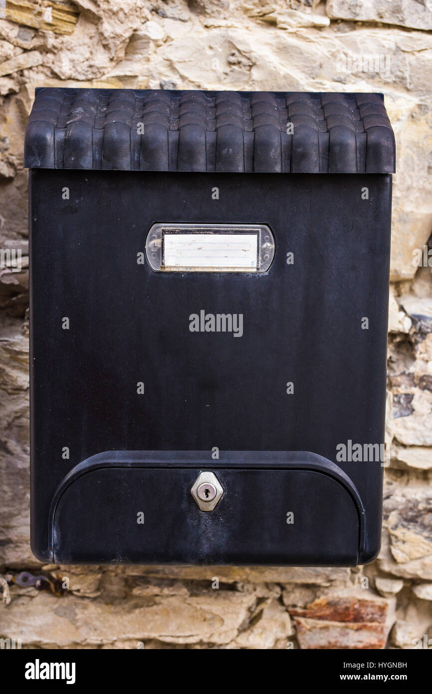 Black mailbox with blank sign for text Stock Photo - Alamy
