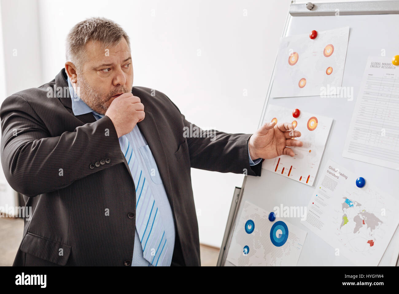 Busy office clerk working on a plan Stock Photo - Alamy