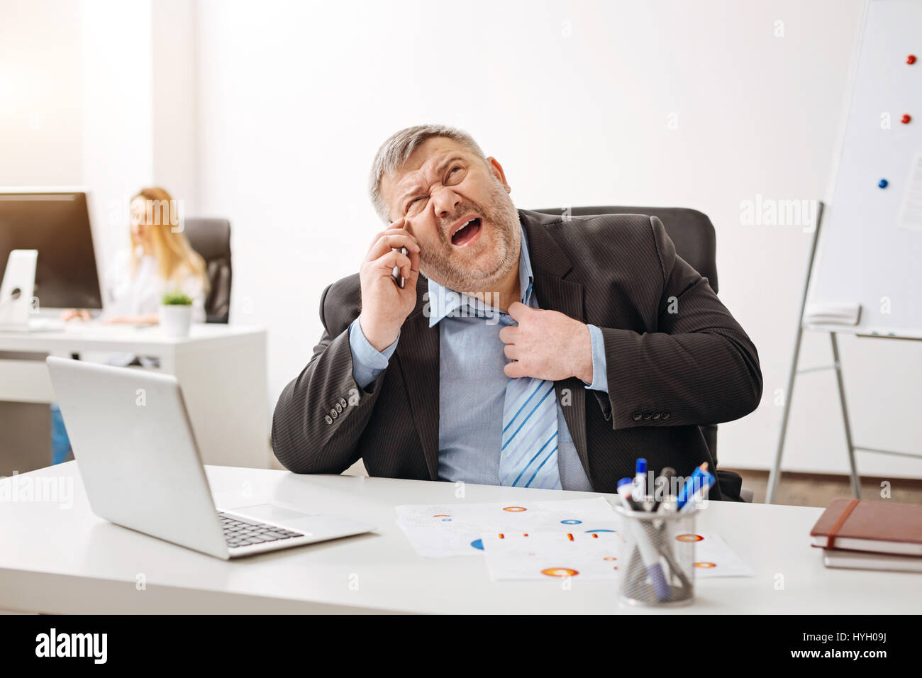 Overweight distressed office worker experiencing heat exhaustion Stock ...