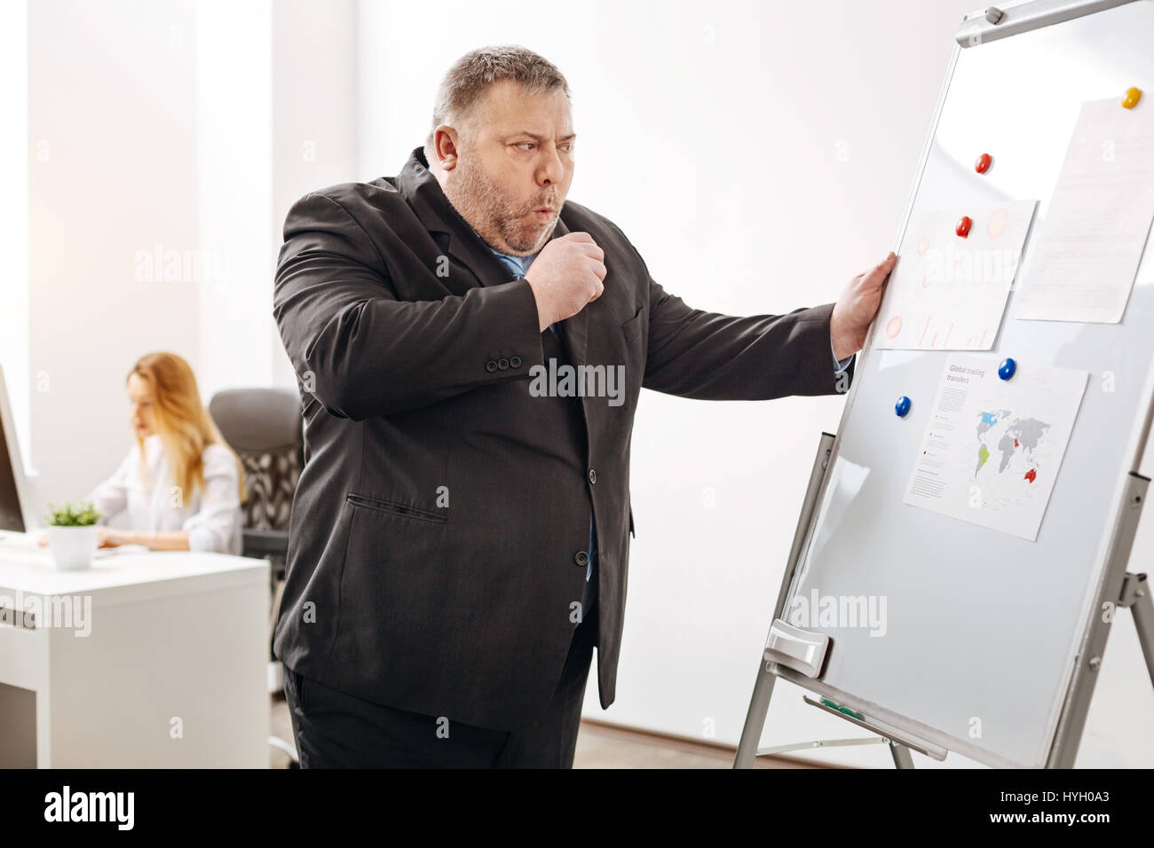 Tireless office worker having a fit of coughing Stock Photo - Alamy