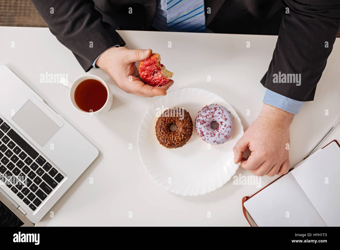 Busy chubby employee having lunch at his workplace Stock Photo - Alamy