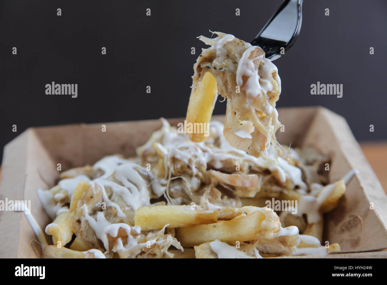 Poutine canada eating hi-res stock photography and images - Alamy