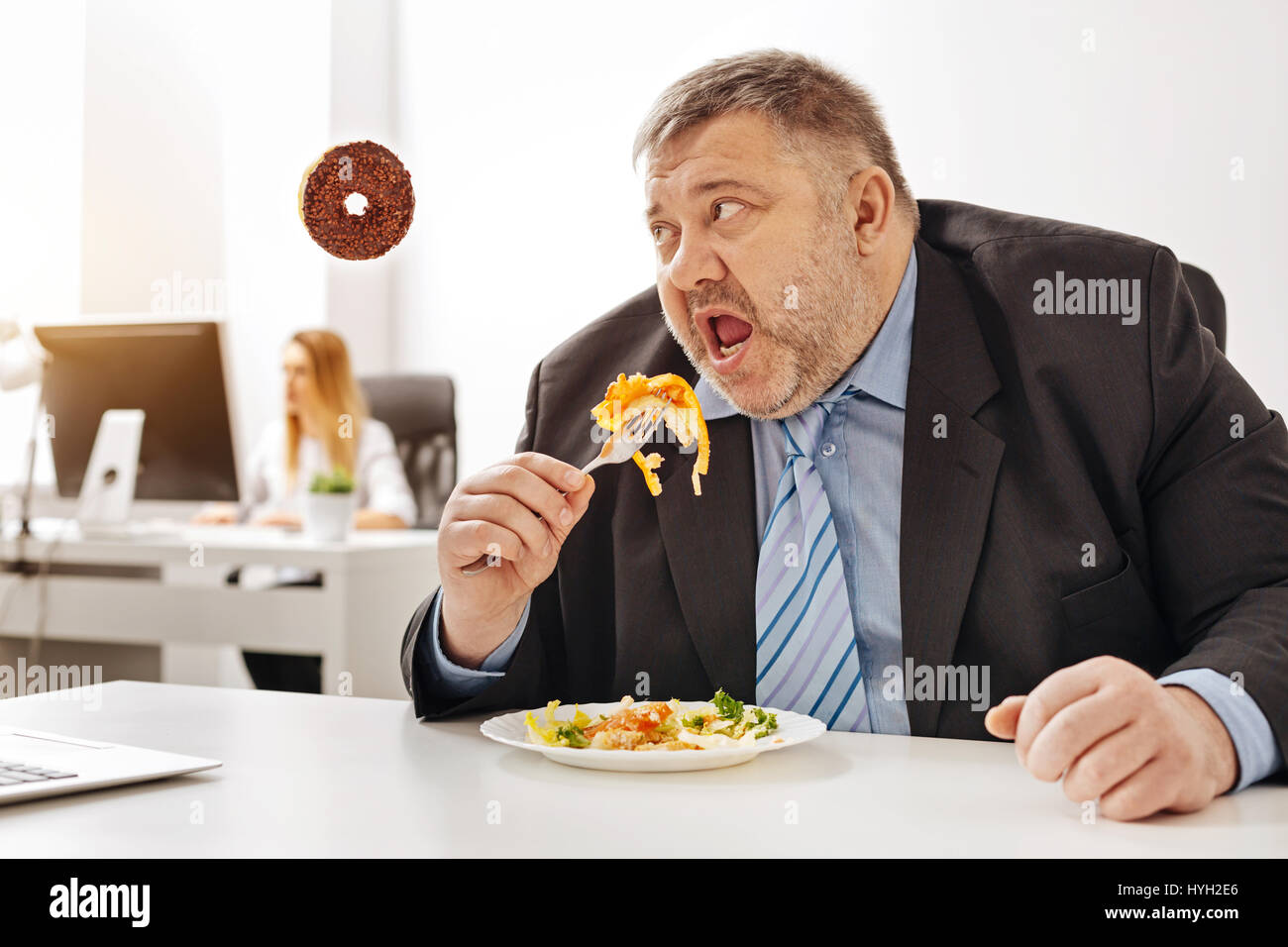 Funny pudgy guy wishing to have some doughnuts Stock Photo - Alamy
