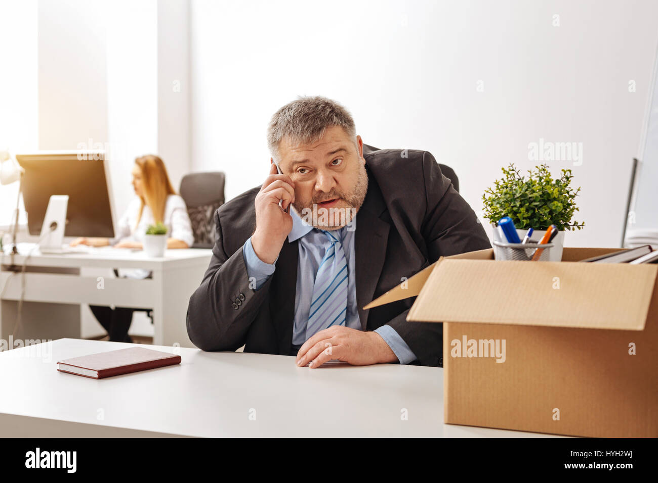 Irritated fired office worker telling bad news Stock Photo - Alamy