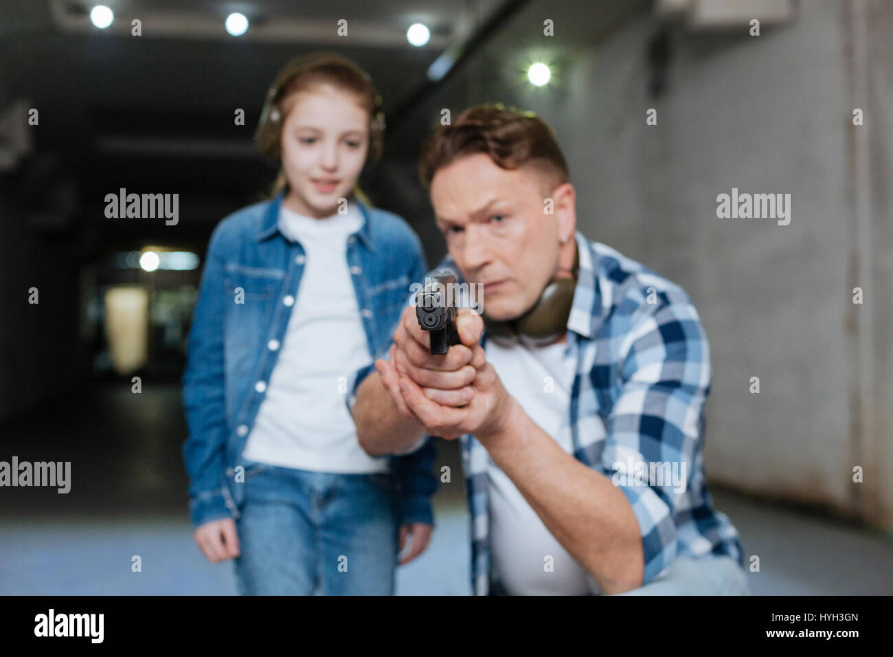 Handsome good looking man directing a handgun at the target Stock Photo ...