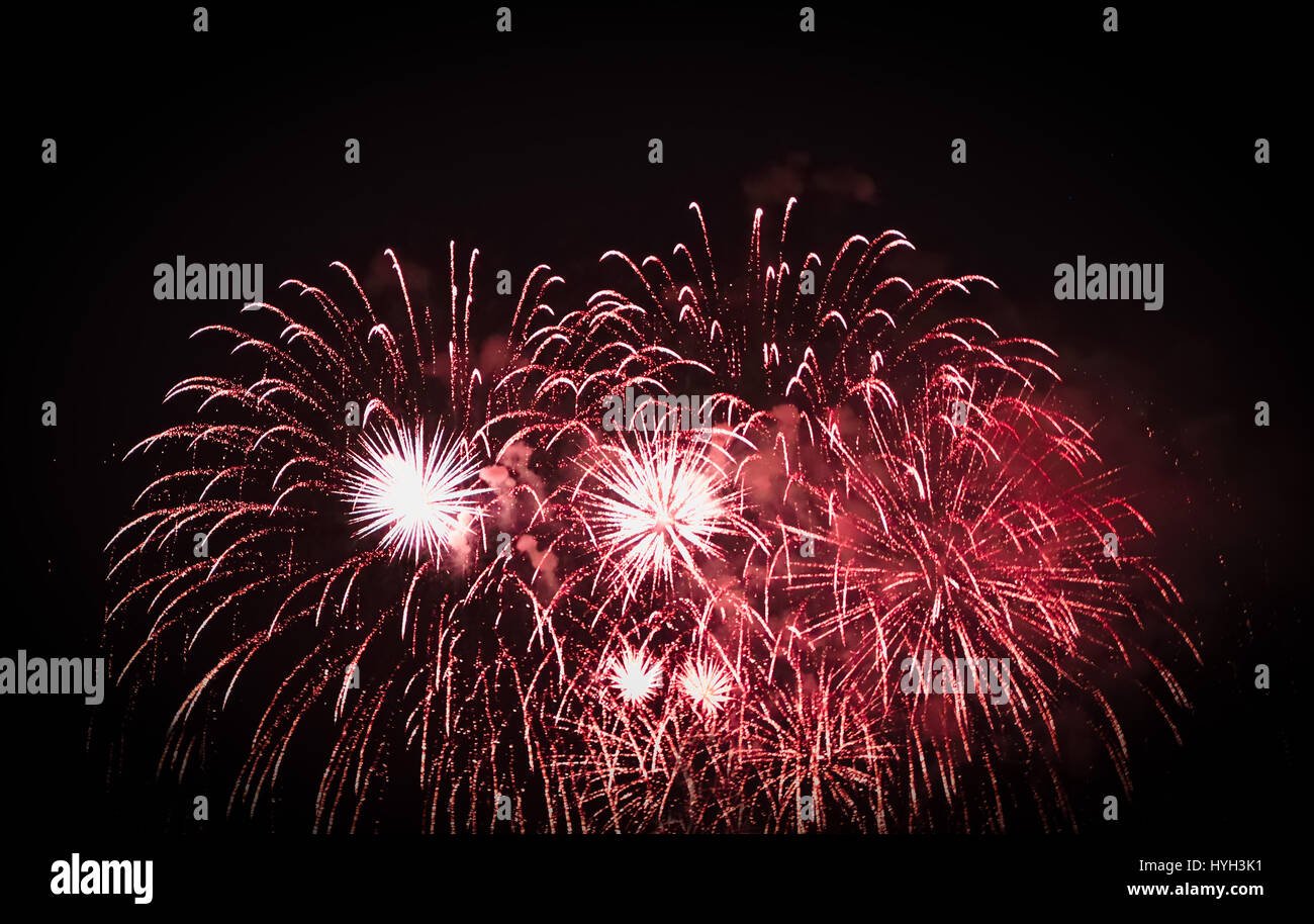 Celebrating with the gorgeous red fireworks Stock Photo - Alamy