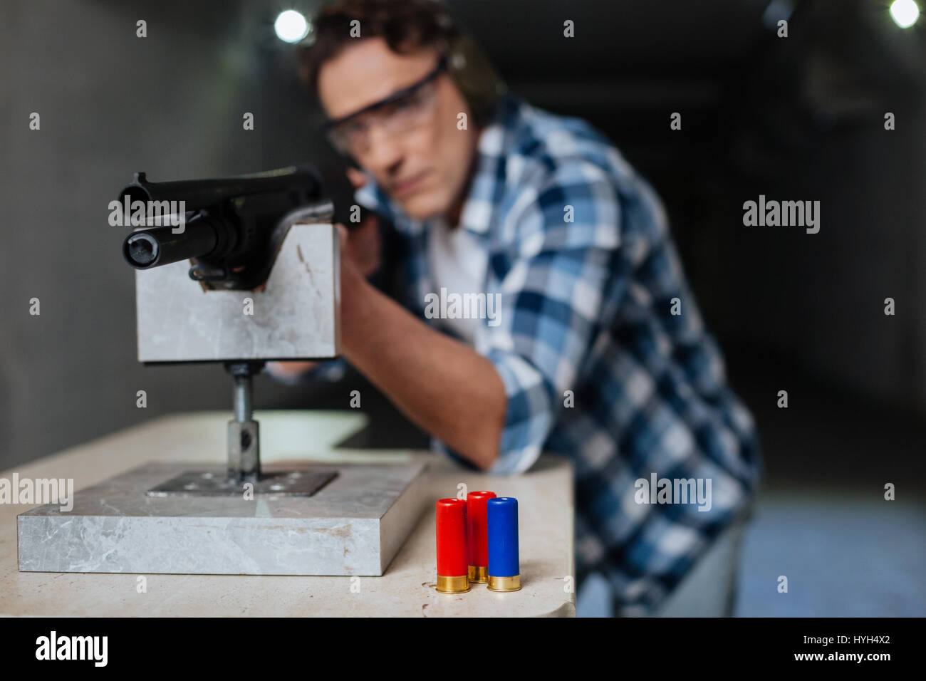 Serious professional marksman choosing the target Stock Photo - Alamy