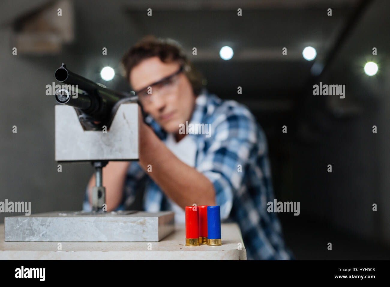 Three rifle bullets standing on the table Stock Photo - Alamy