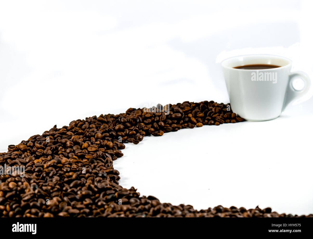 Coffee beans and coffee cup Stock Photo - Alamy
