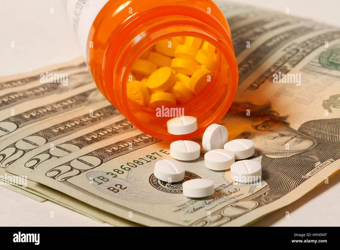 Drug Money - Prescription drugs on twenty dollar bills Stock Photo - Alamy