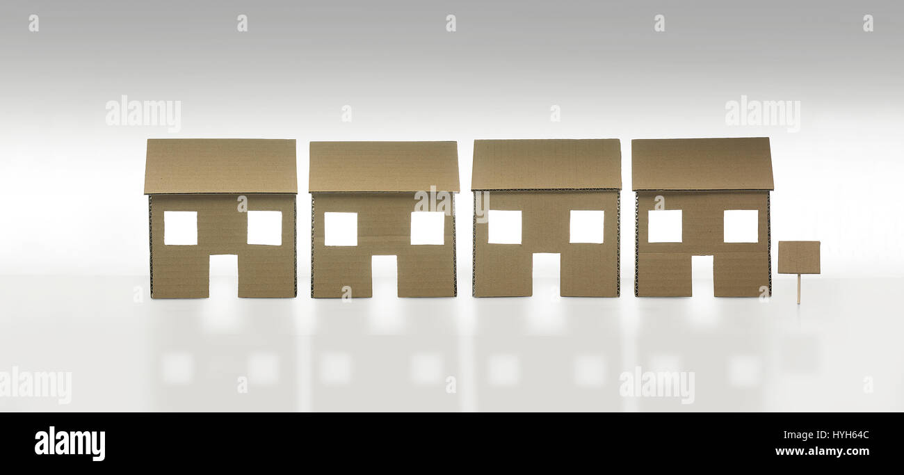 Row of Cardboard Houses with blank sign for artwork Stock Photo - Alamy